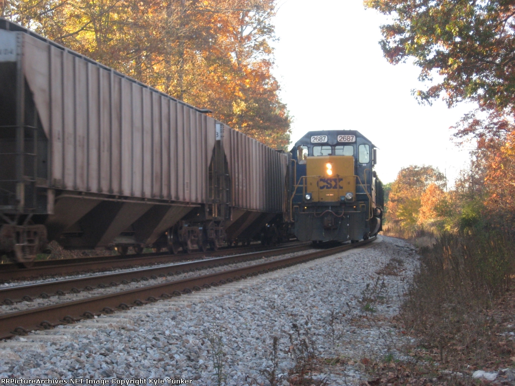 A lone GP38-2 is todays Cartersville local as it sneaks up on me whiel a NB grain train passes ...